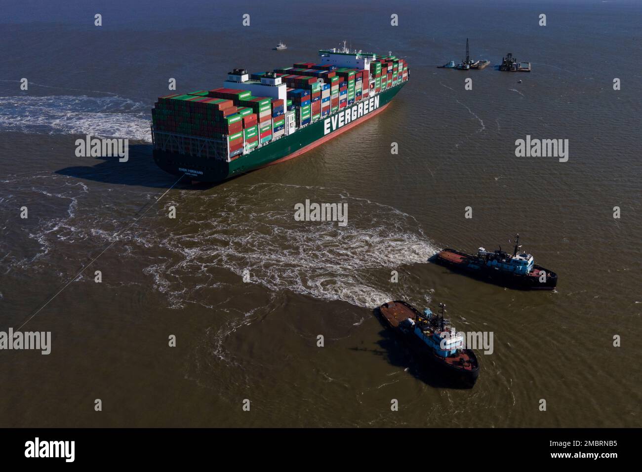 The tugboats Atlantic Enterprise, center bottom, and Atlantic Salvor ...