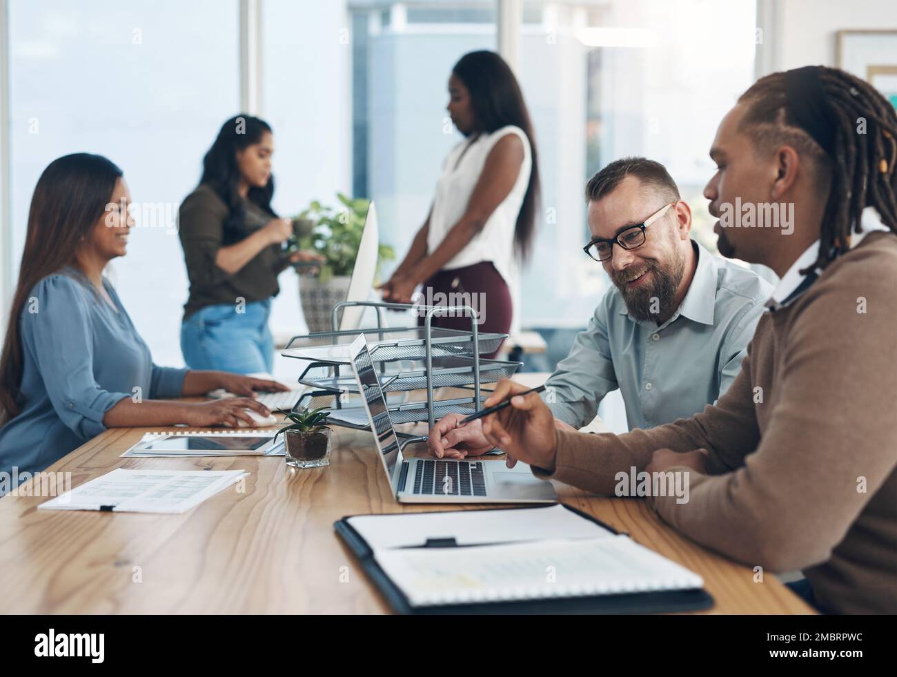 Youre doing great with this task. two handsome businessmen sitting and ...
