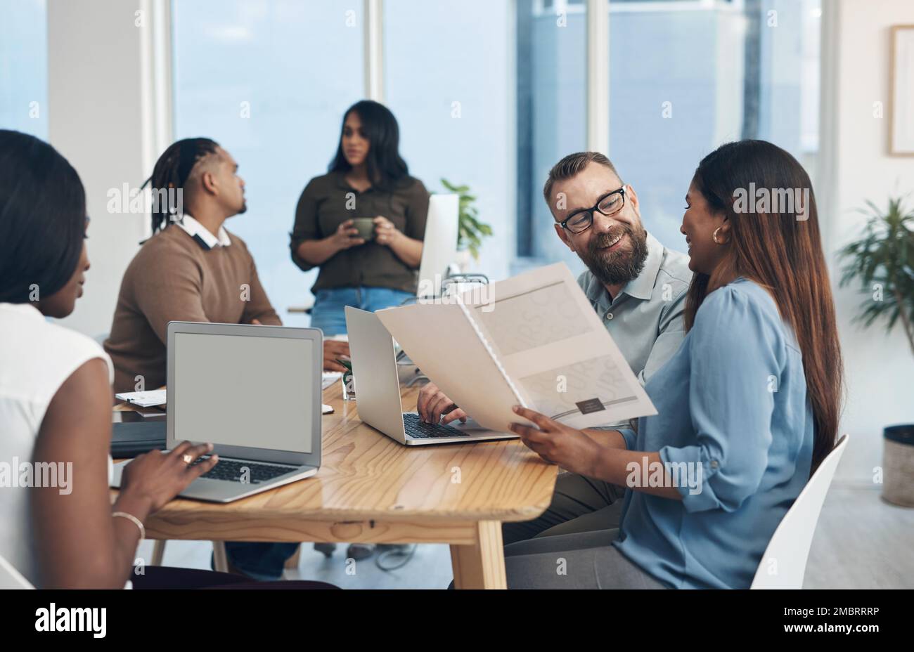 Weve got great ideas. two young businesspeople sitting together and ...