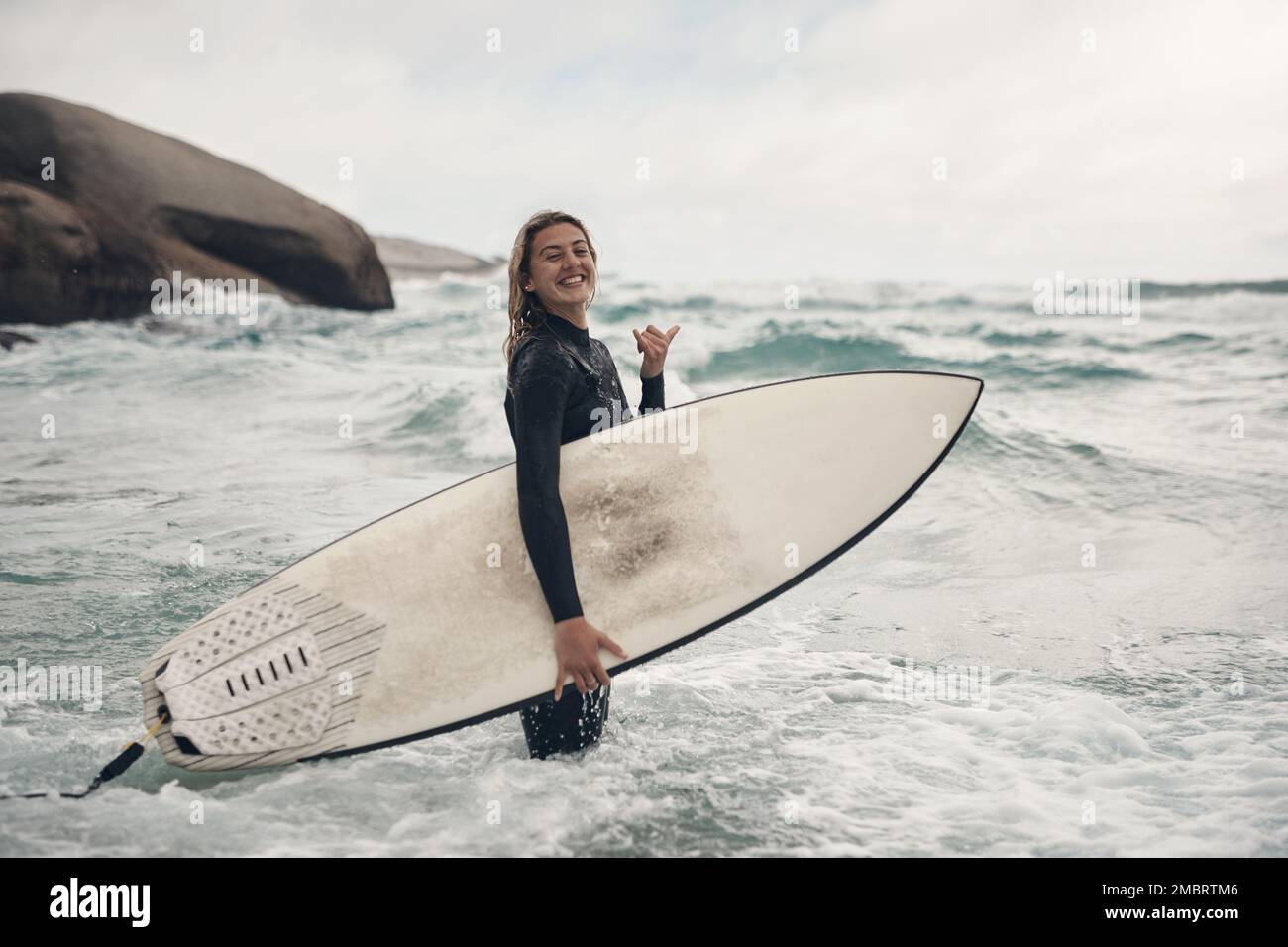 There is now other sport like it. a young woman out surfing at the ...