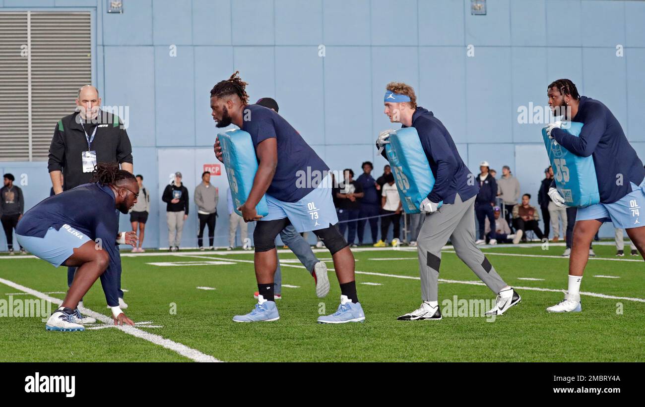 North Carolina offensive lineman Joshua Ezeudu, left, lines up for a ...
