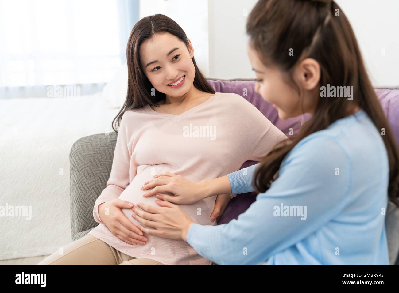 Pregnant women to family life Stock Photo - Alamy