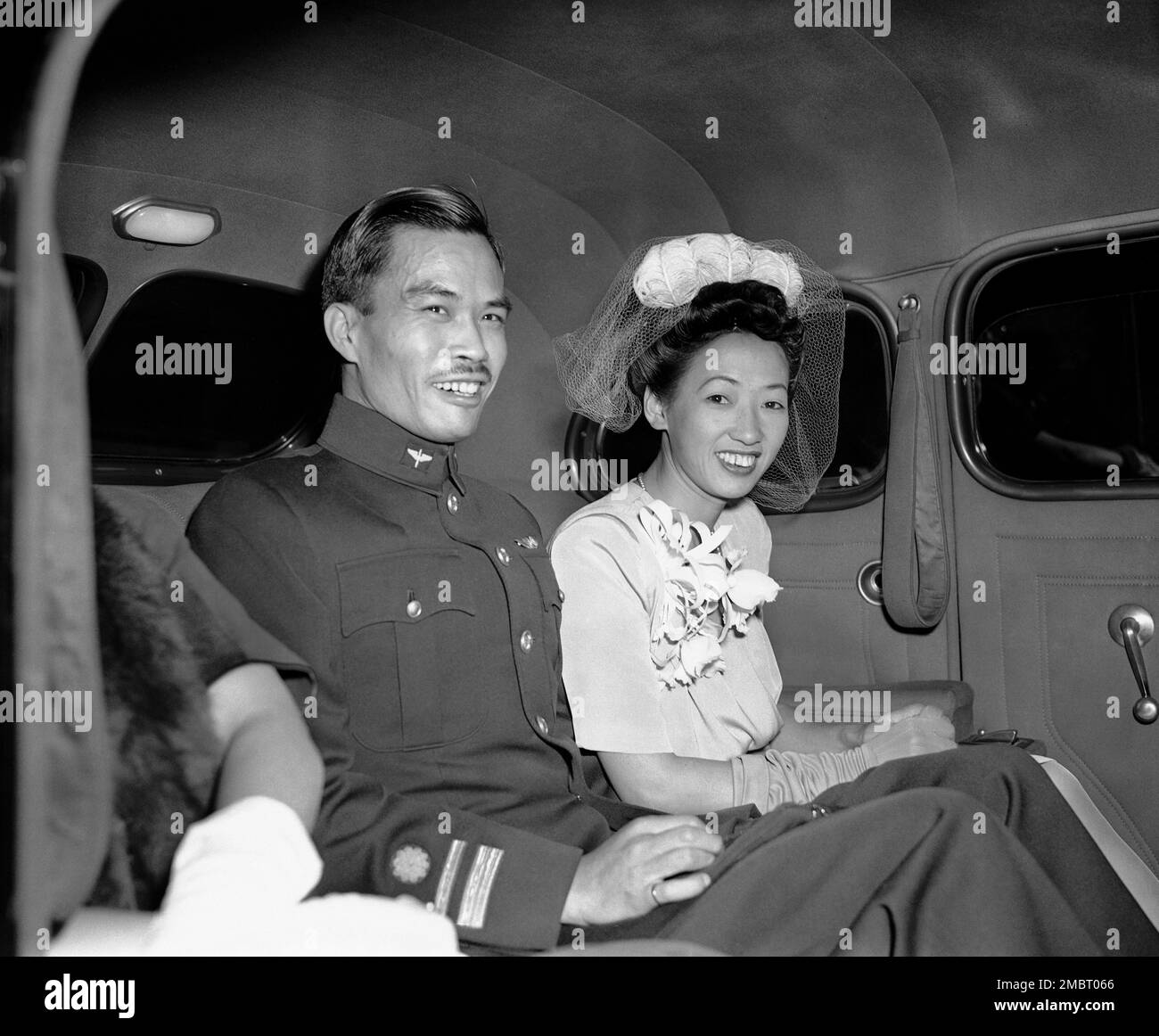 Major Yin Cheung Louie, left, 29-year-old pilot in the Chinese Army and ...