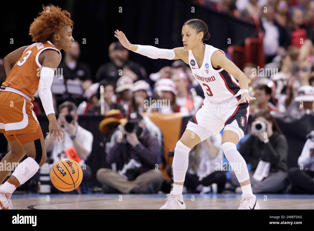 Stanford guard Anna Wilson, right, defends Texas guard Rori Harmon ...