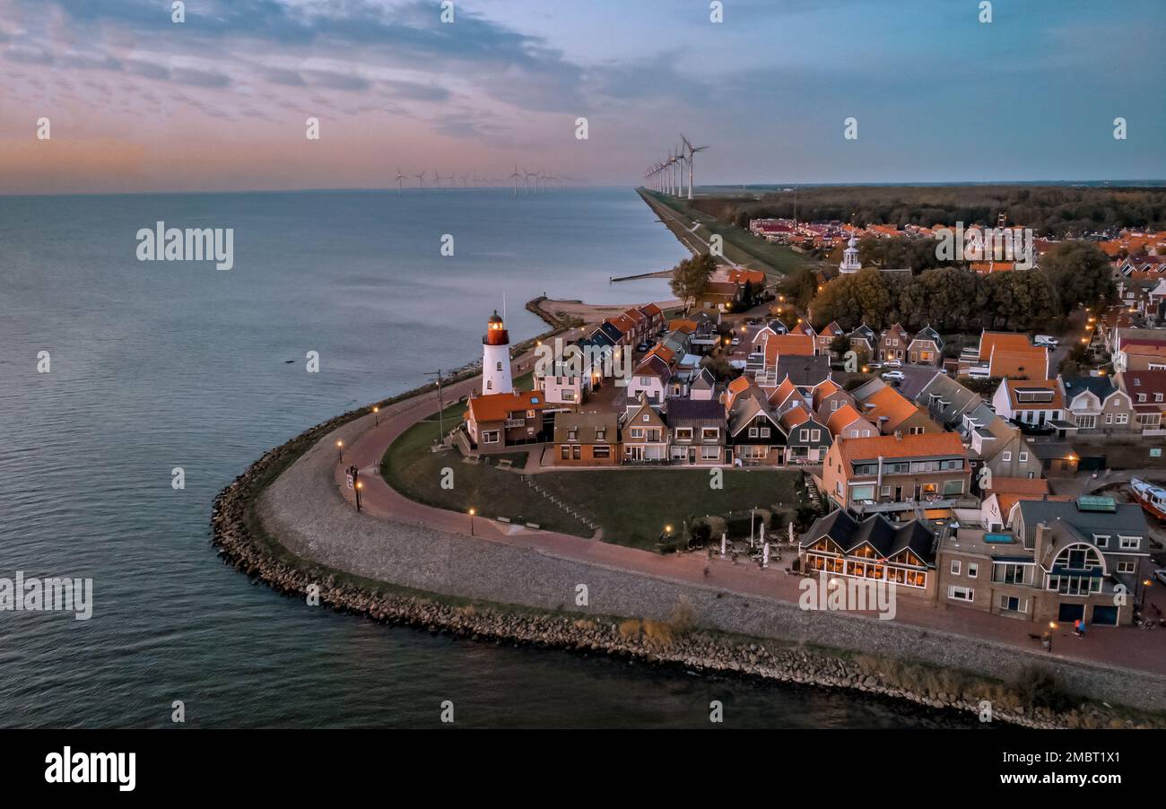 Urk Flevoland Netherlands sunset at the lighthouse and harbor of Urk ...