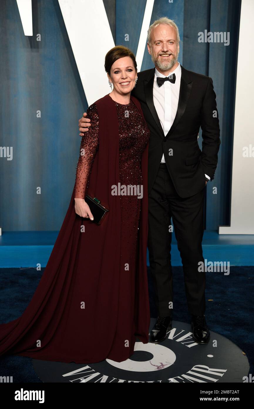 Olivia Colman, left, and Ed Sinclair arrive at the Vanity Fair Oscar ...