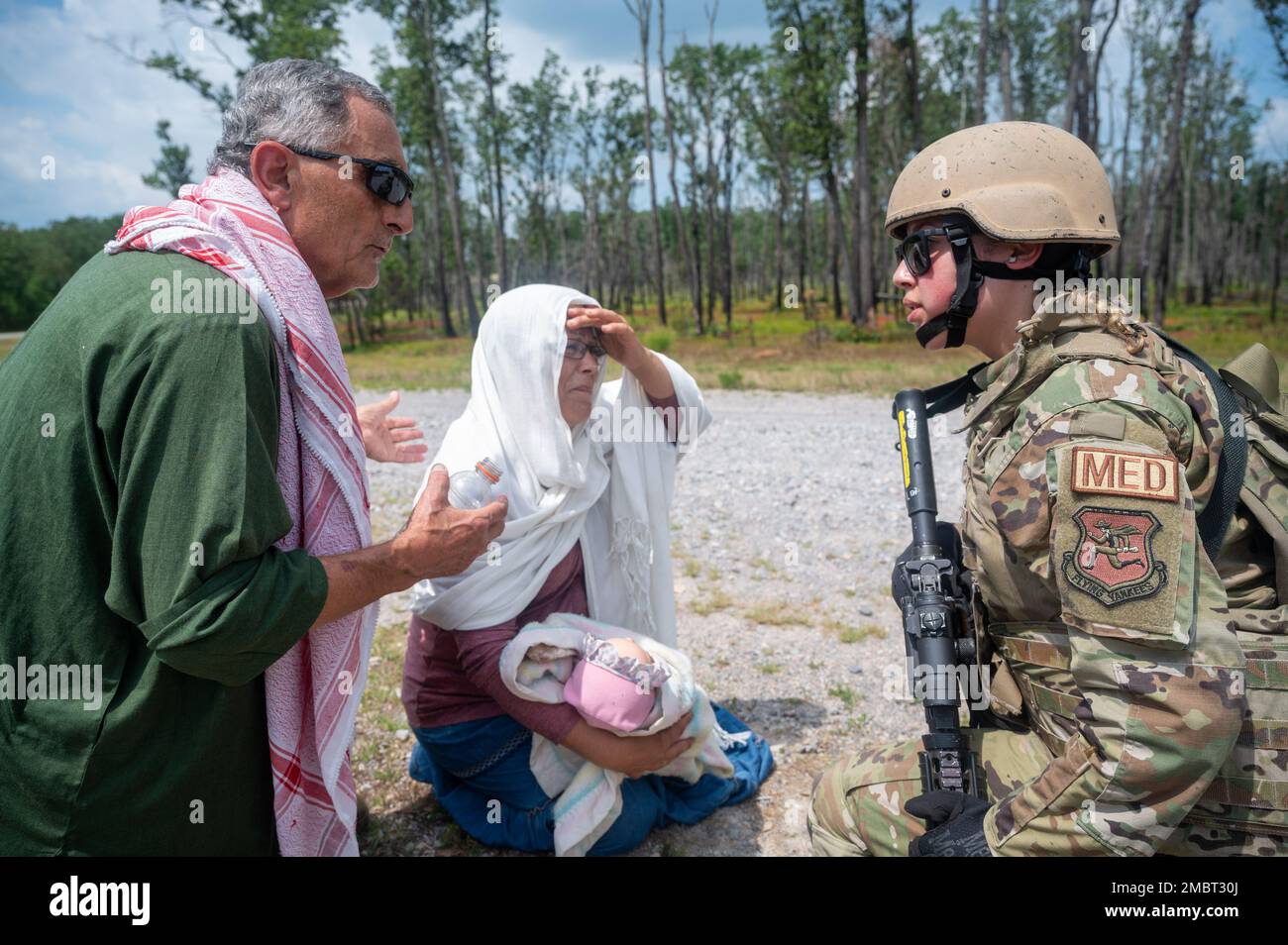 U.S. Air Force Senior Airman Meilany Caimares triages a baby during ...