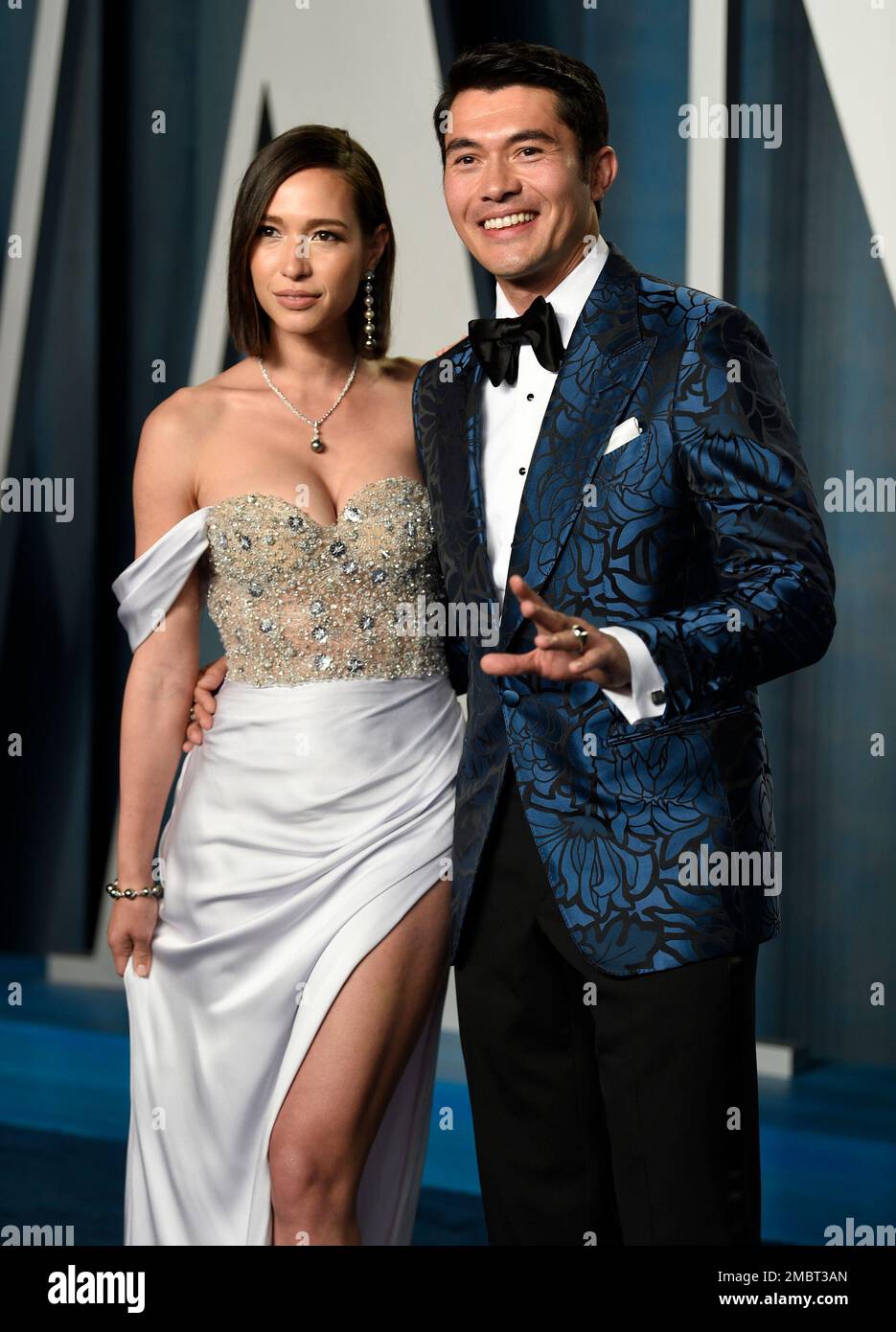 Liv Lo, left, and Henry Golding arrive at the Vanity Fair Oscar Party ...