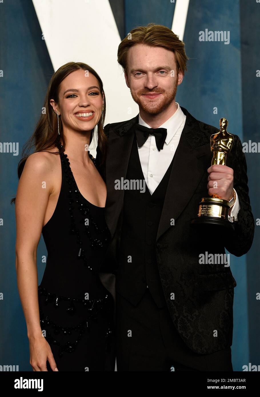 Claudia Sulewski, left, and Finneas arrive at the Vanity Fair Oscar ...