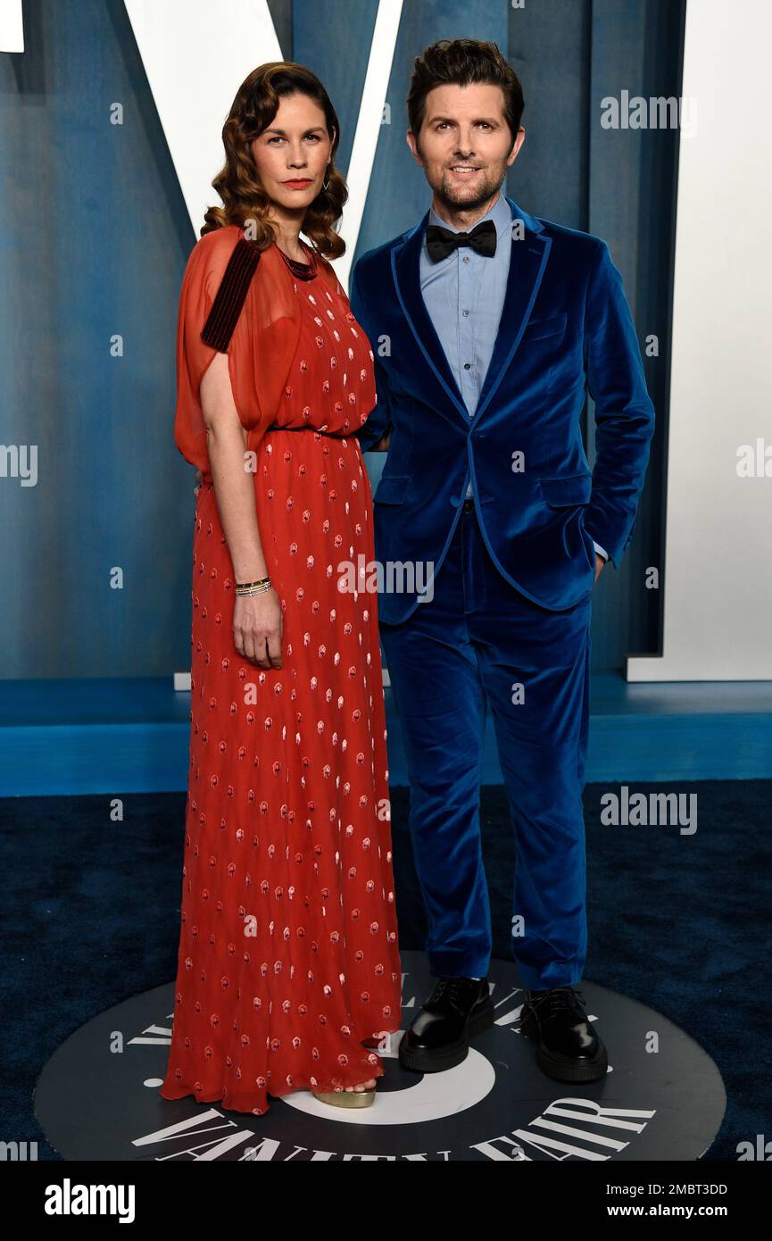 Naomi Sablan, left, and Adam Scott arrives at the Vanity Fair Oscar ...