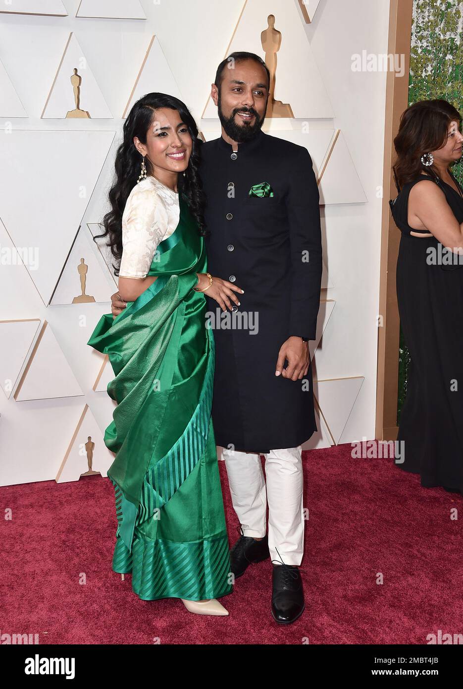 Rintu Thomas, left, and Sushmit Ghosh arrive at the Oscars on Sunday, March 27, 2022, at the ...
