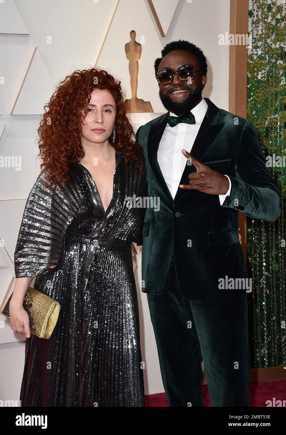 Alma Har'el, left, and Byron Bowers arrive at the Oscars on Sunday ...