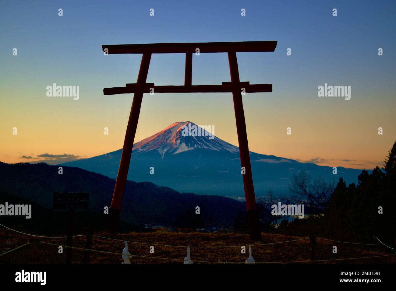 The traditional Japanese red torii gates with the Mount Fuji in the ...