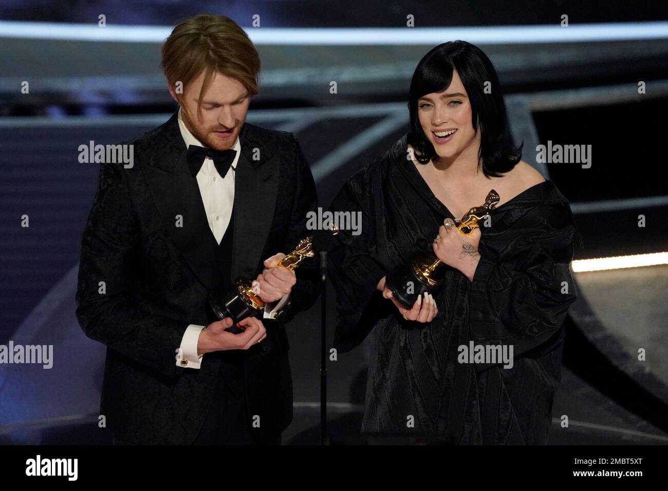 Billie Eilish, right, and Finneas O'Connell accept the award for best ...