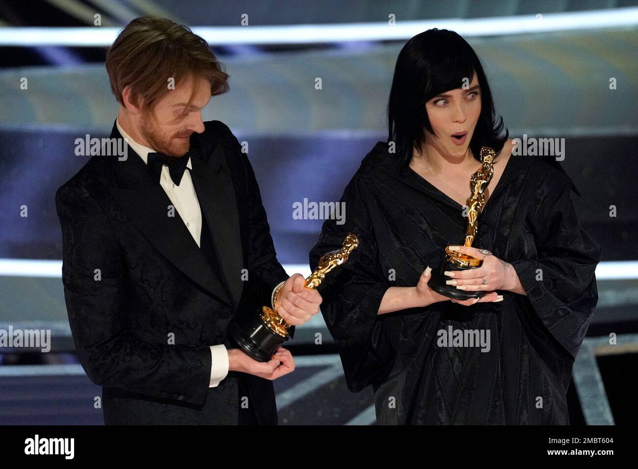 Billie Eilish, right, and Finneas O'Connell accept the award for best ...