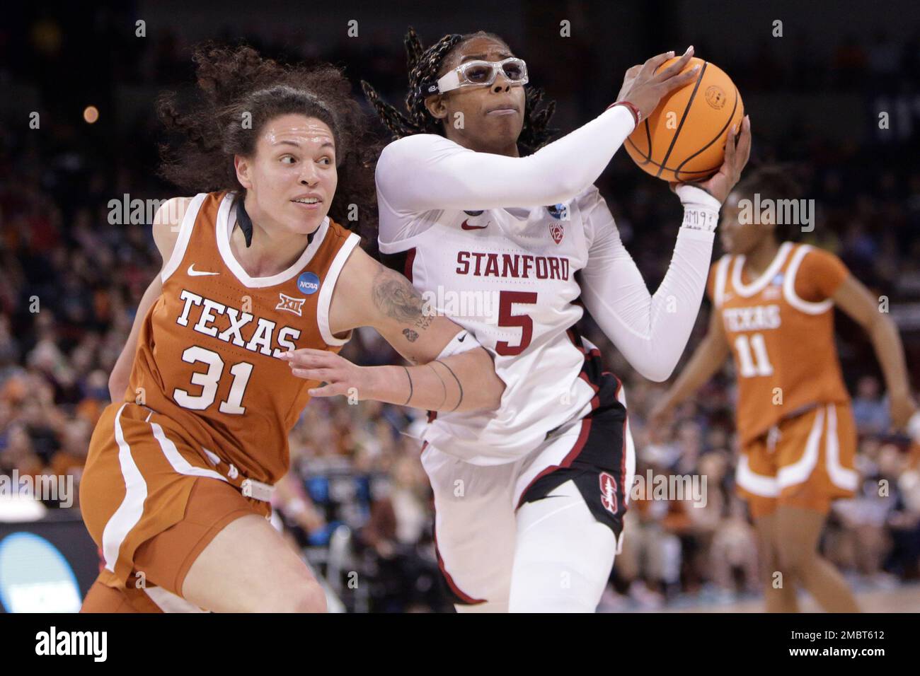 Stanford forward Francesca Belibi (5) is pressured by Texas guard ...