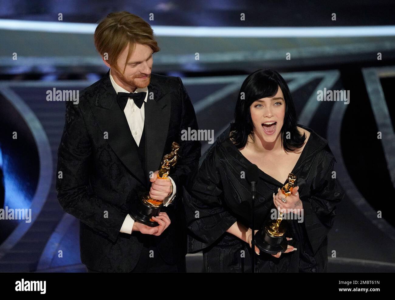 Billie Eilish, right, and Finneas O'Connell accept the award for best ...