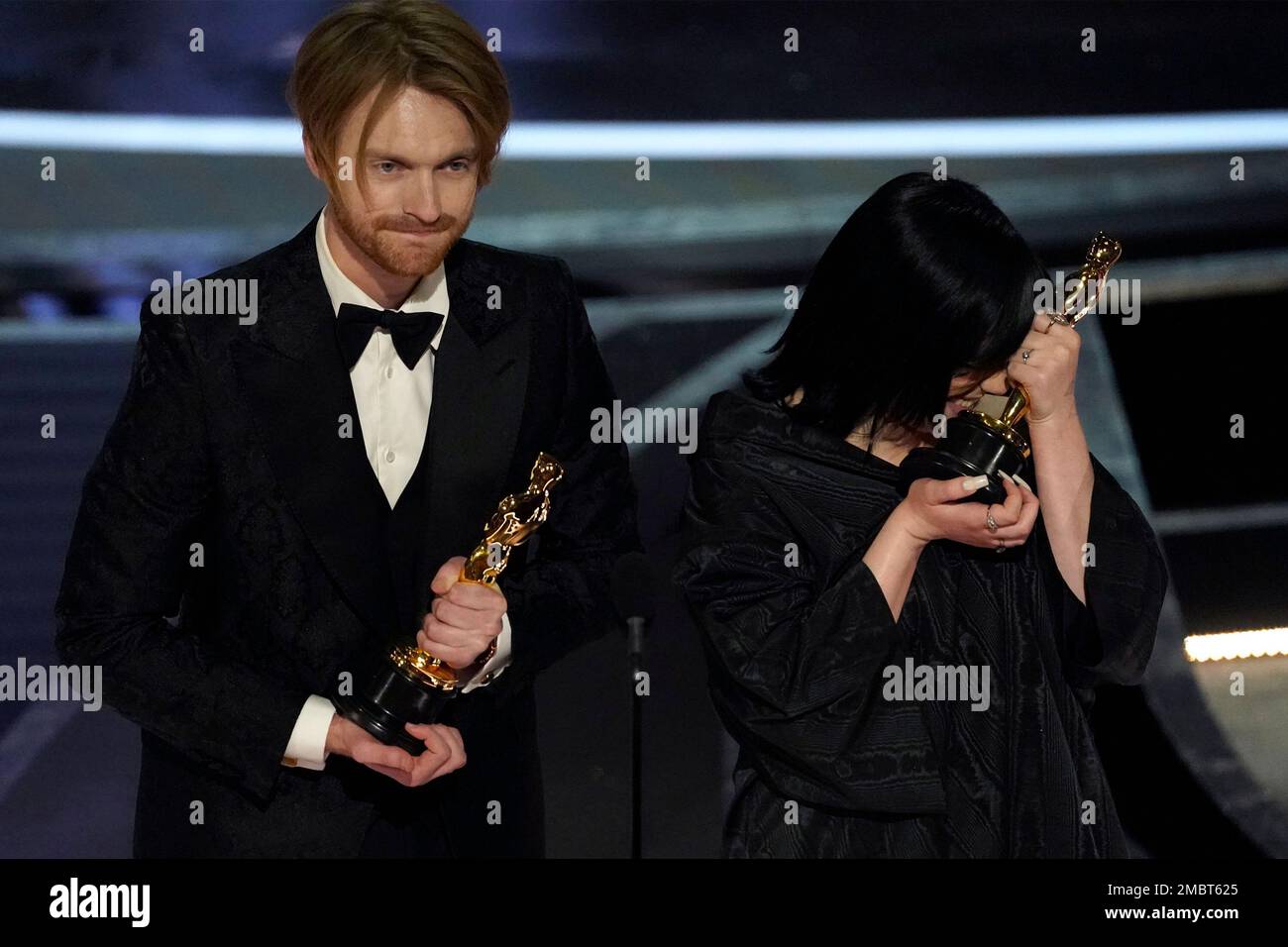 Billie Eilish, right, and Finneas O'Connell accept the award for best ...