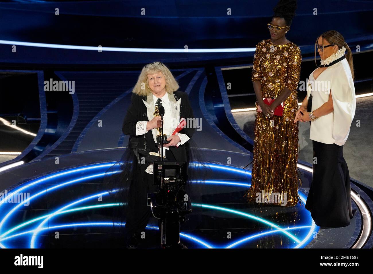 Jenny Beavan, left, accepts the award for best costume design for ...
