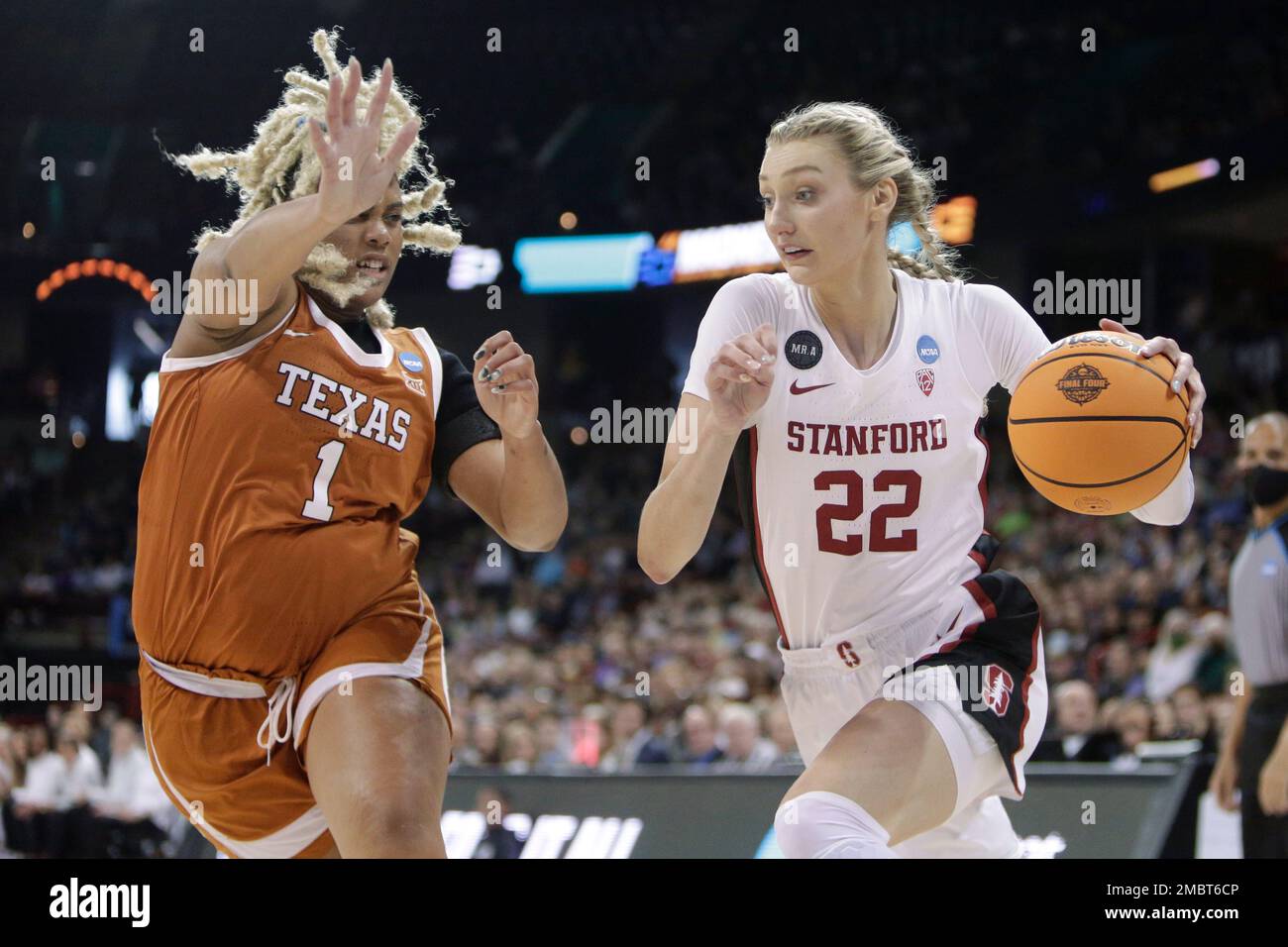 Stanford forward Cameron Brink (22) drives around the defense of Texas ...