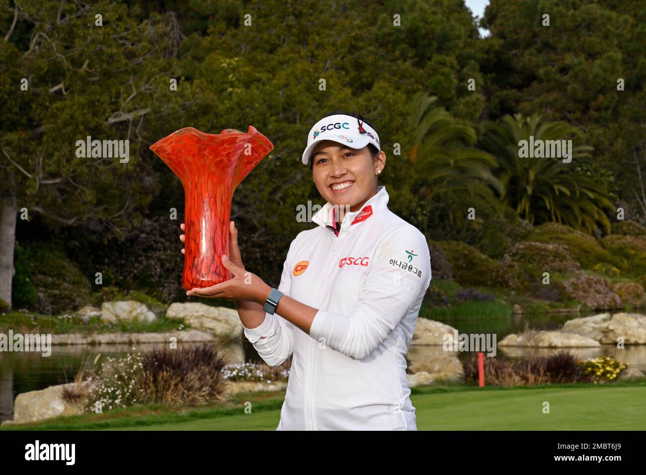 Atthaya Thitikul, of Thailand, holds up the trophy after winning the ...