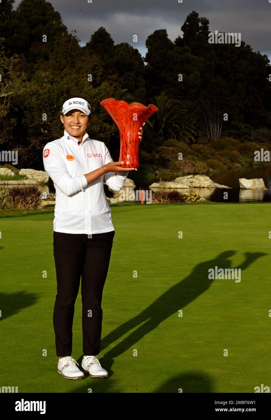Atthaya Thitikul, of Thailand, holds up the trophy after winning the ...