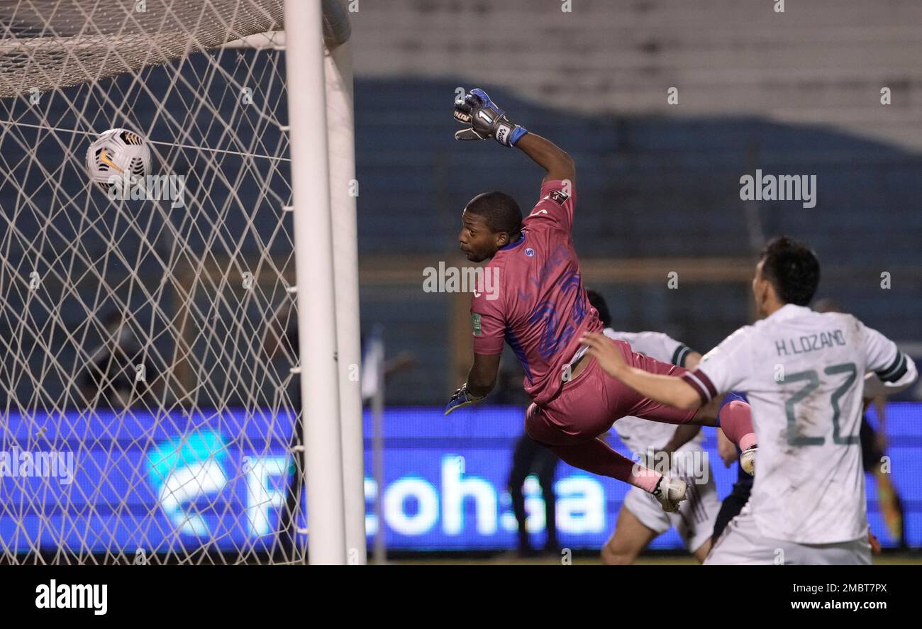 Honduras' goalkeeper Roberto Lopez watches the ball as Mexico's Edson ...