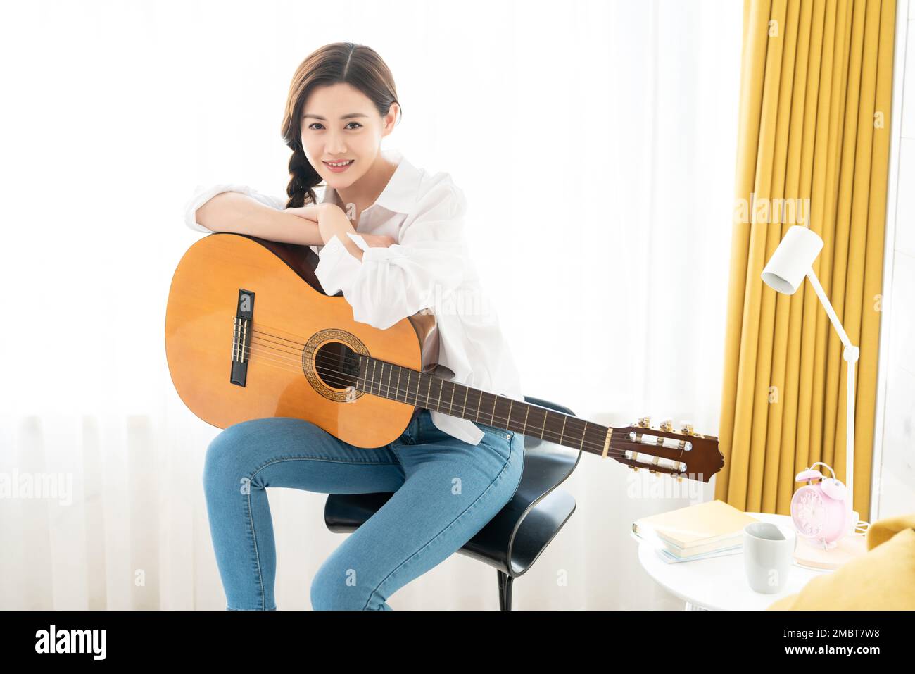 The young woman the bullet guitar Stock Photo - Alamy