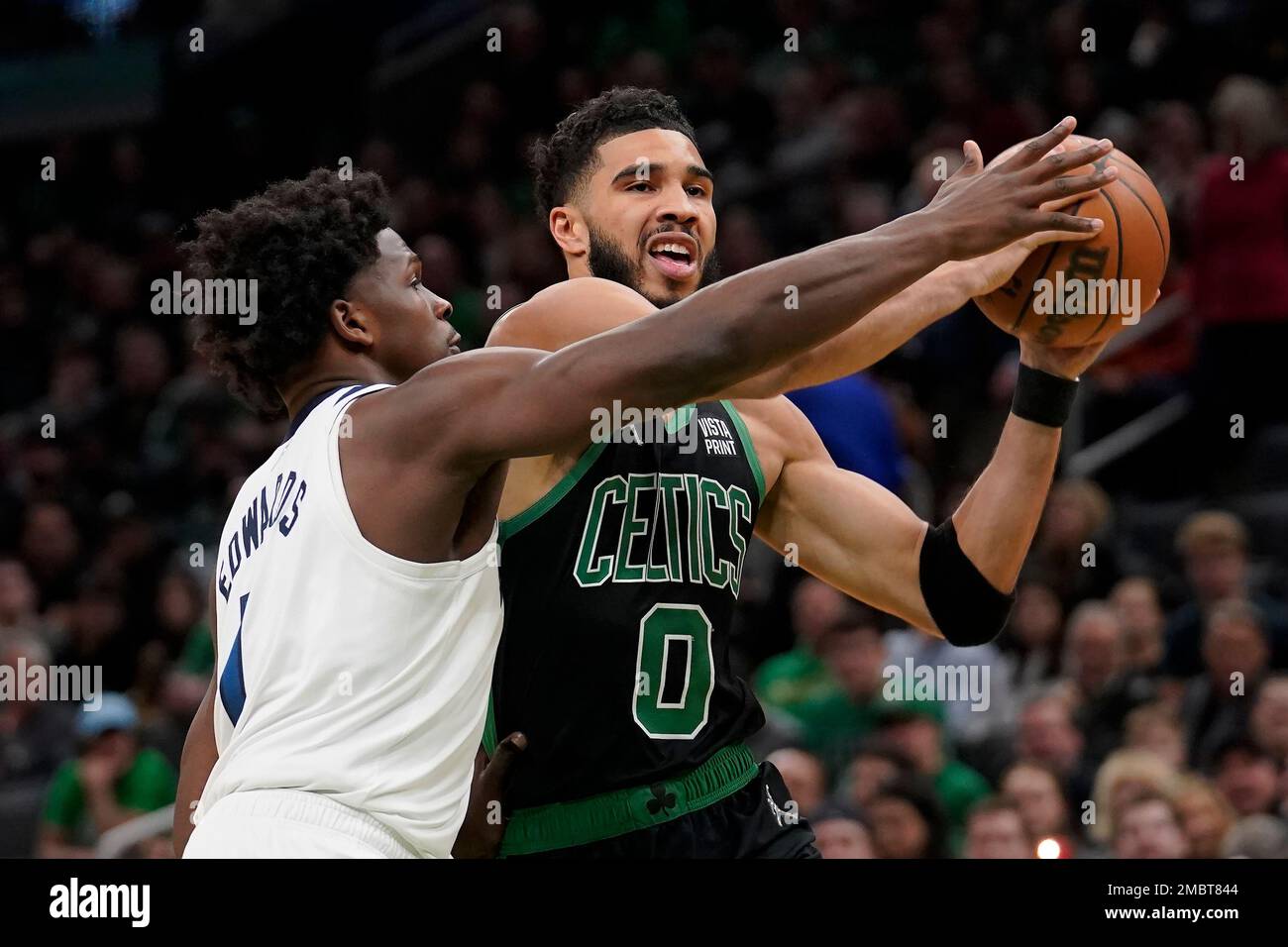 Boston Celtics forward Jayson Tatum (0) drives toward the basket past ...
