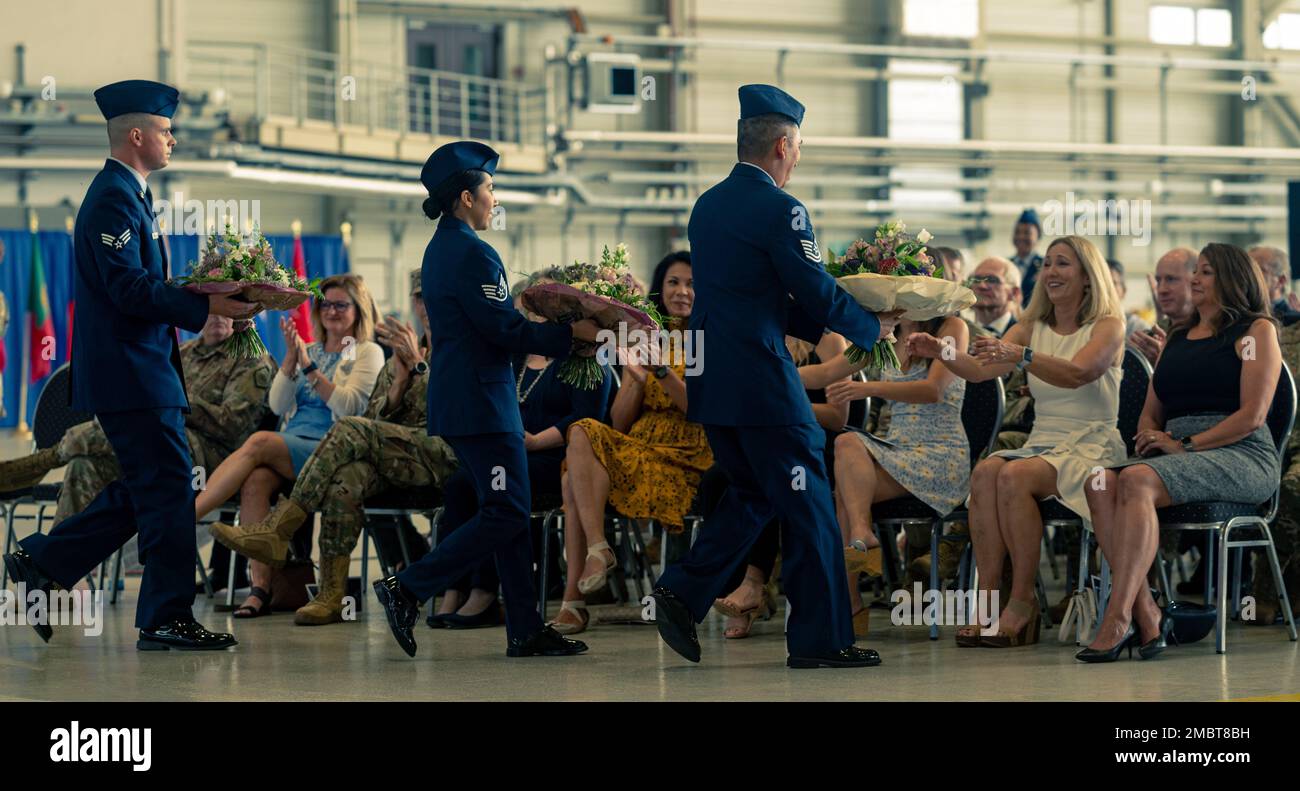 U.S. Air Force Airmen deliver flowers to Maj. Gen. Derek France’s ...