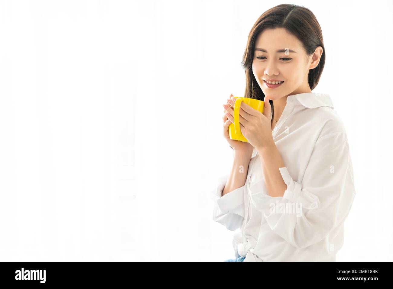 Young man in comfortable home Cut Out Stock Images & Pictures - Alamy