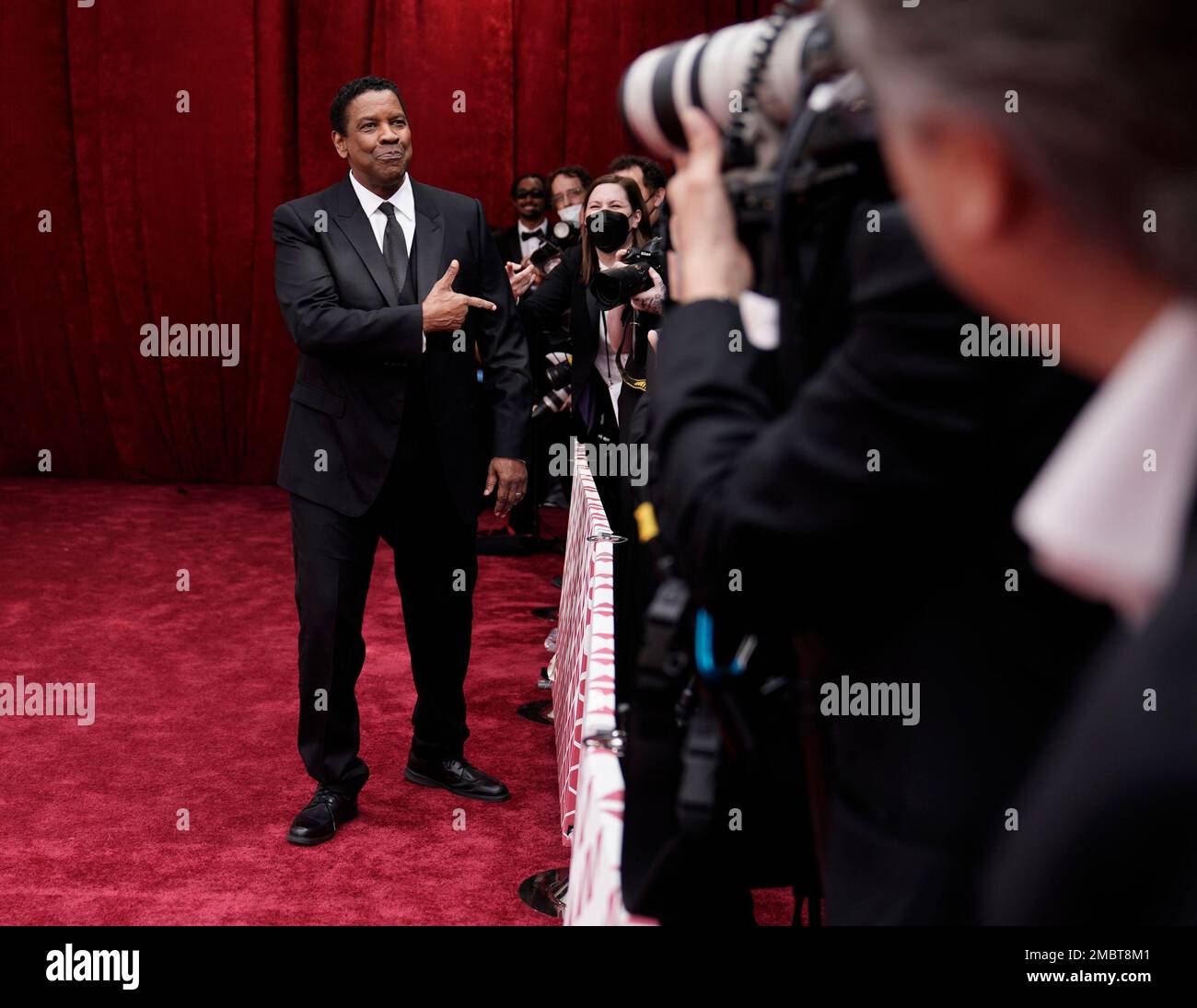 Denzel Washington arrives at the Oscars on Sunday, March 27, 2022, at ...