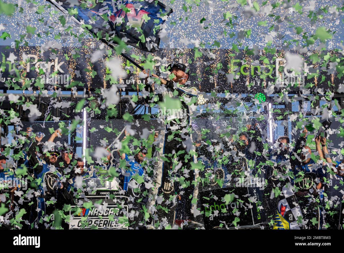 Ross Chastain, center, celebrates after winning a NASCAR Cup Series ...