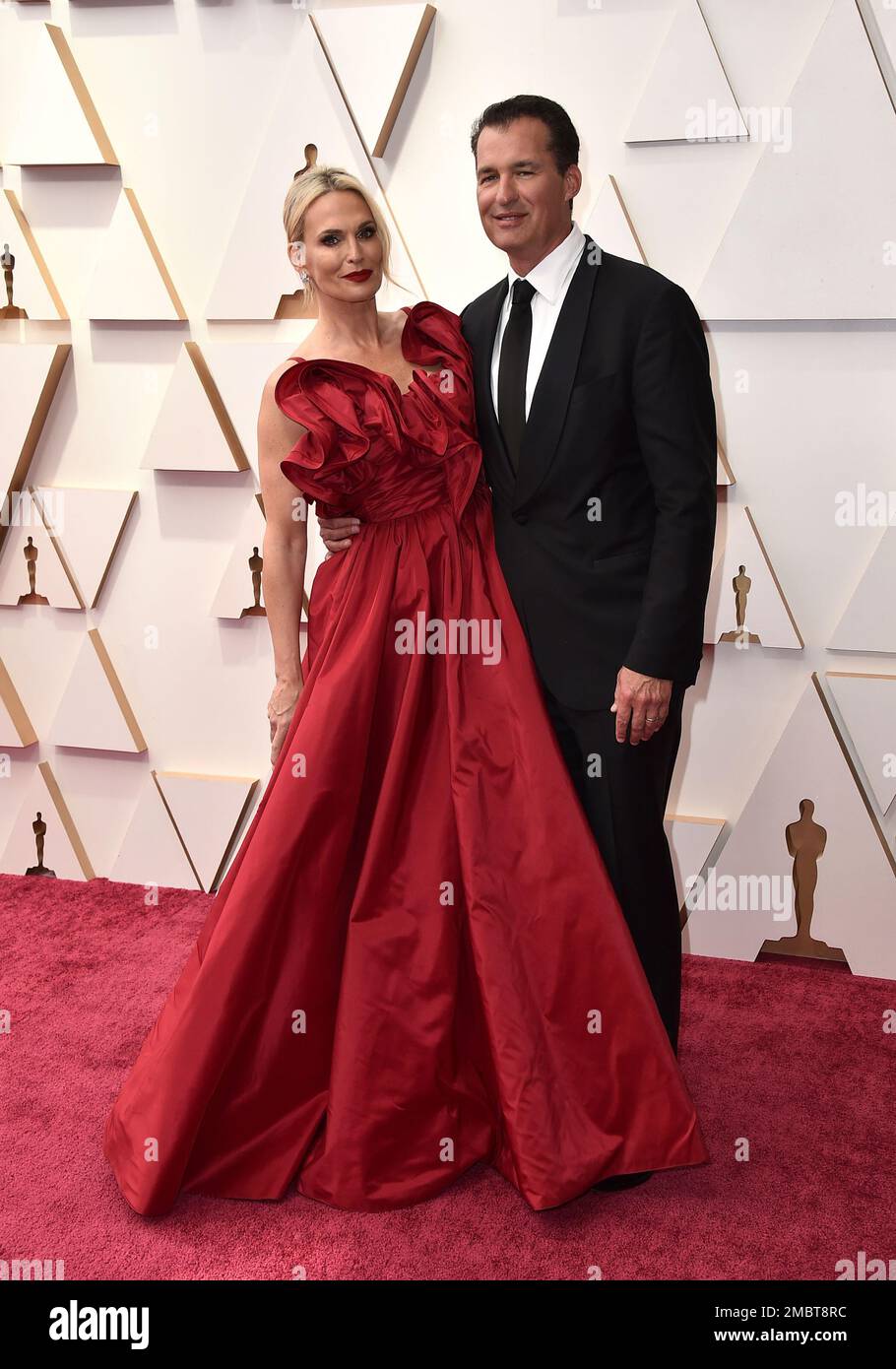 Molly Sims, left, and Scott Stuber arrive at the Oscars on Sunday ...