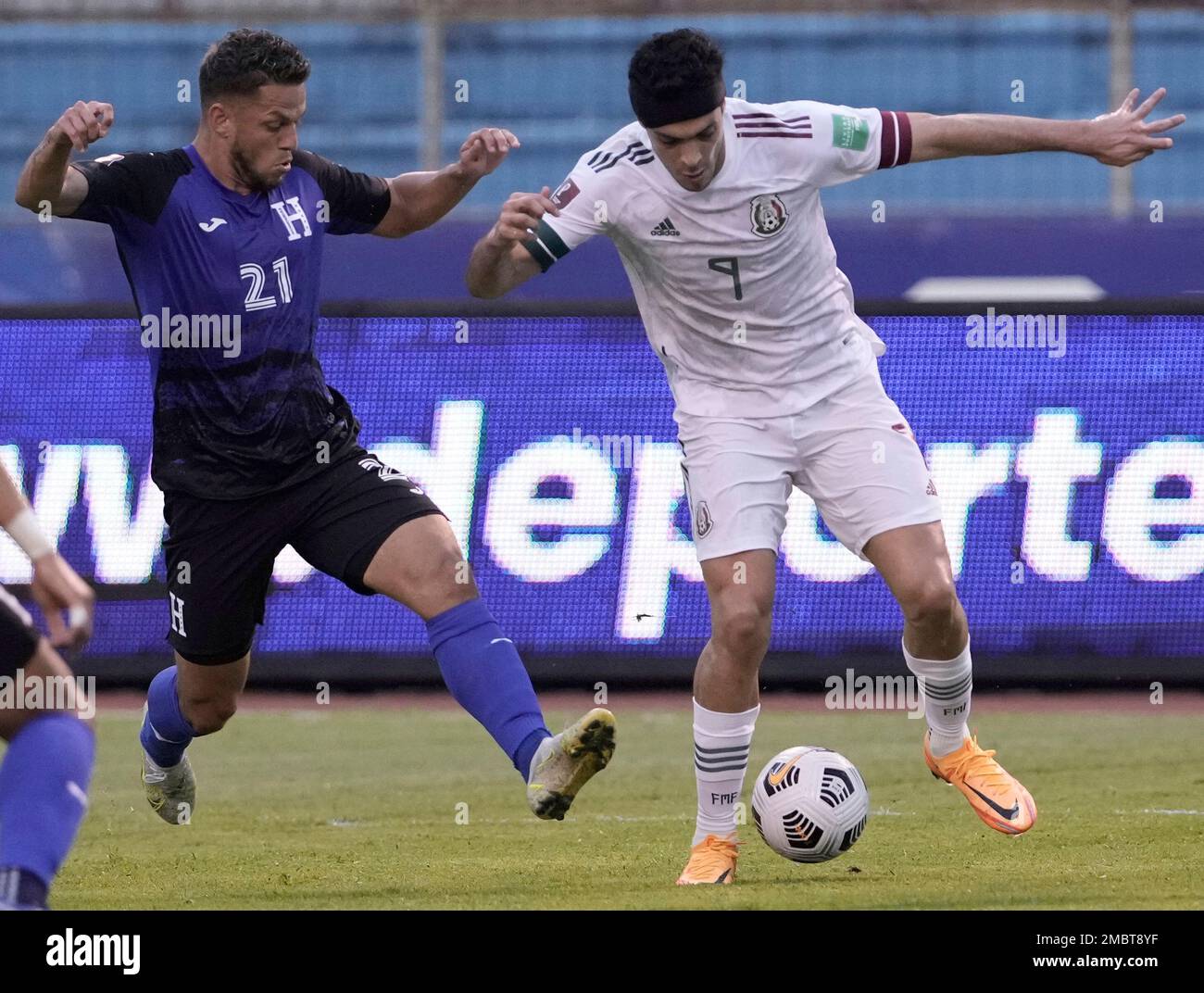 Mexico's Raul Jimenez, right, and Honduras' Marcelo Santos fight for the ball during a ...