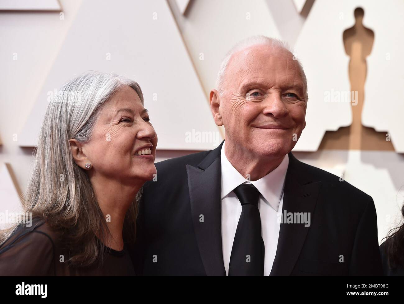 Stella Arroyave, left, and Anthony Hopkins arrive at the Oscars on ...