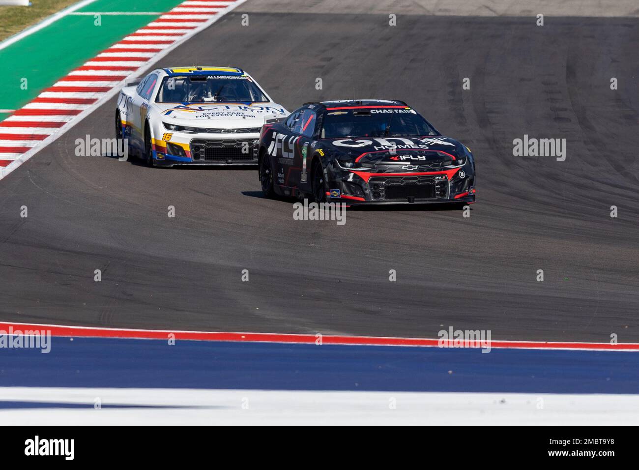 AJ Allmendinger, left, and Ross Chastain (1) steer out of Turn 12 ...