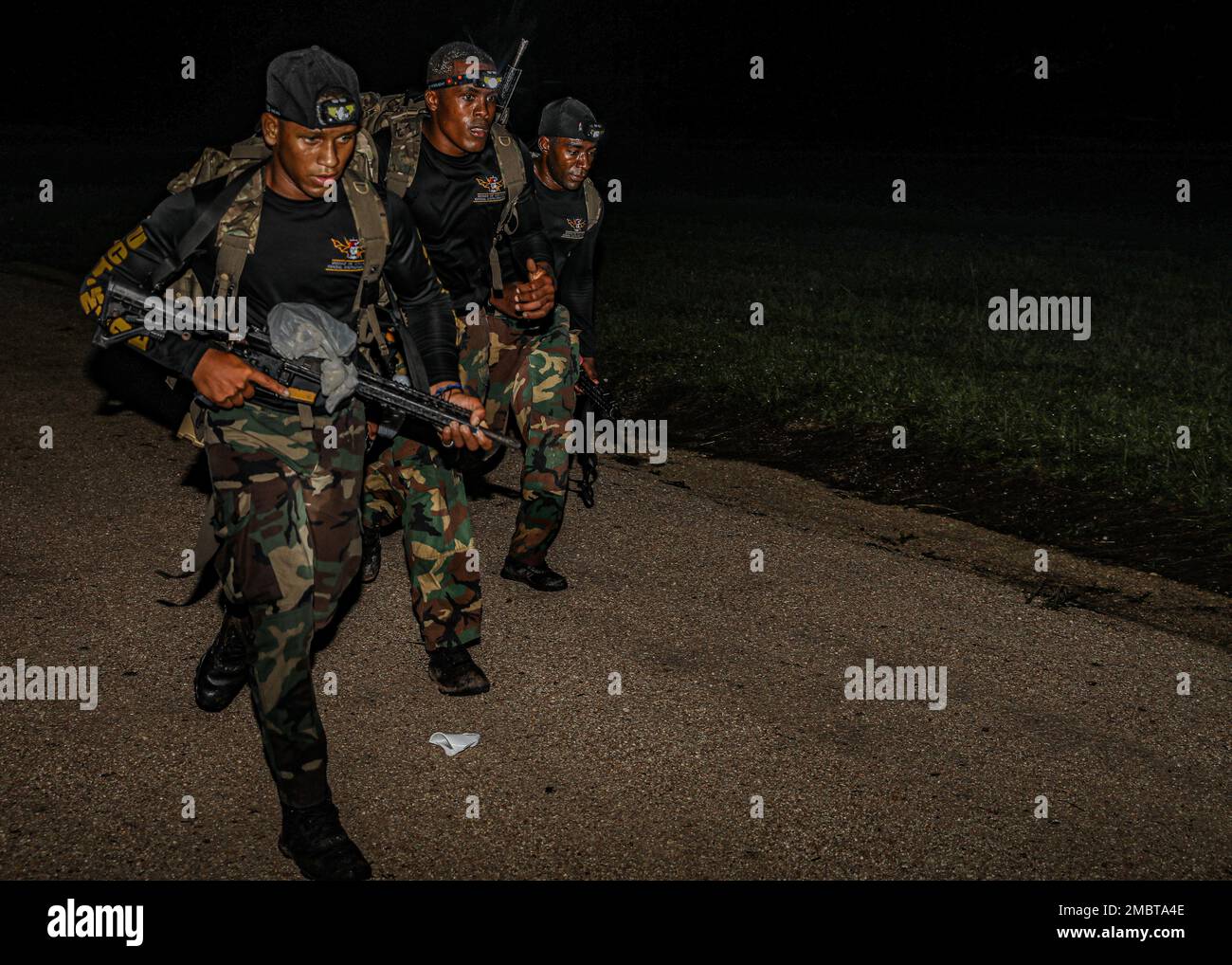 The Dominican Republic team cross the finish line of a 12-mile ruck ...