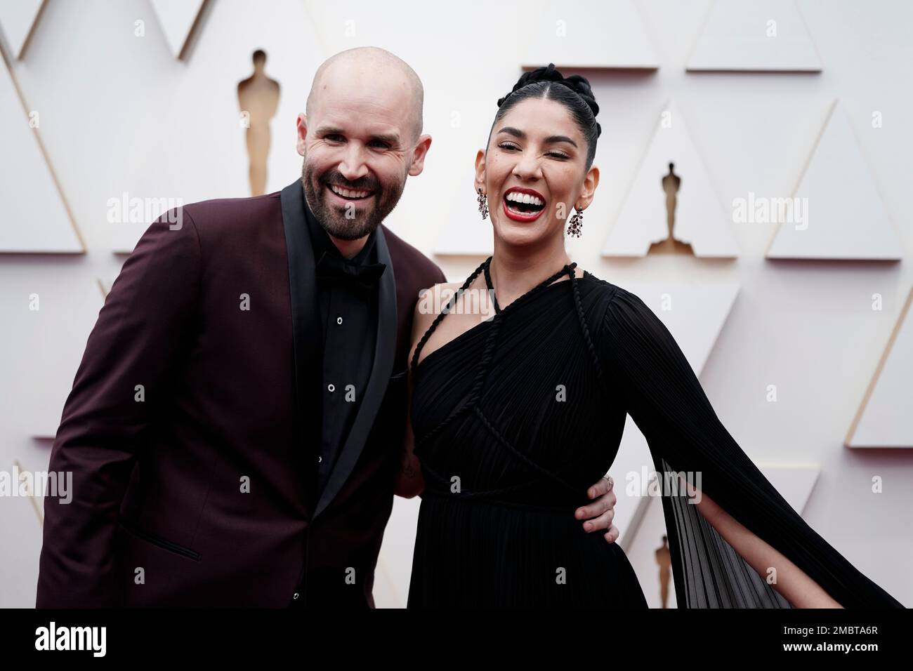 Brad Hoss, left, and Stephanie Beatriz arrive at the Oscars on Sunday ...