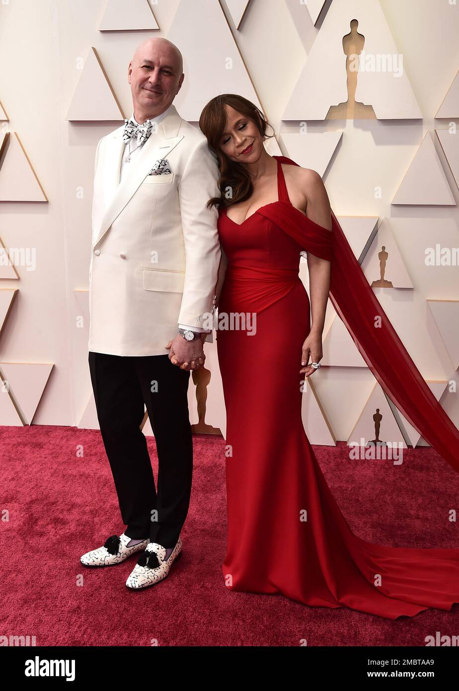 Eric Haze, left, and Rosie Perez arrive at the Oscars on Sunday, March ...
