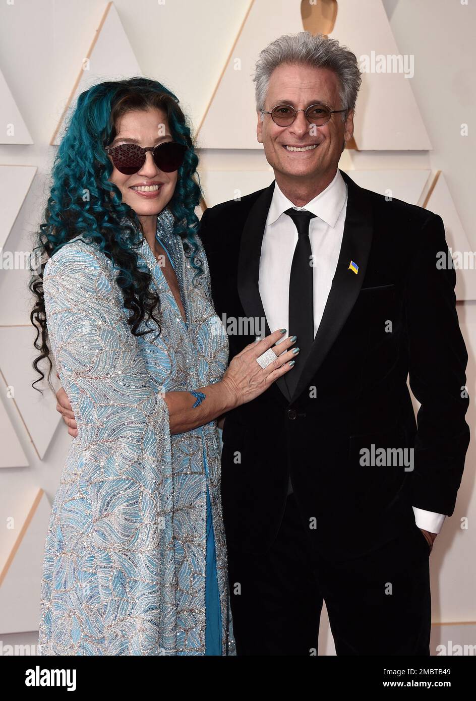 Ann Mangini, left, and Mark Mangini arrive at the Oscars on Sunday ...