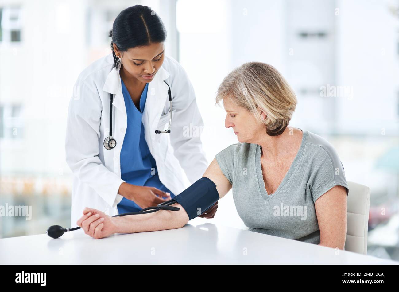 Dont leave it before its too late. a young doctor examining a senior ...