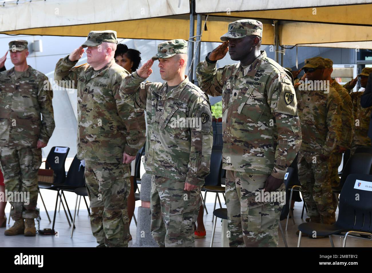 From left, U.S. Army Lt. Col Brian M. Travis outgoing commander of ...