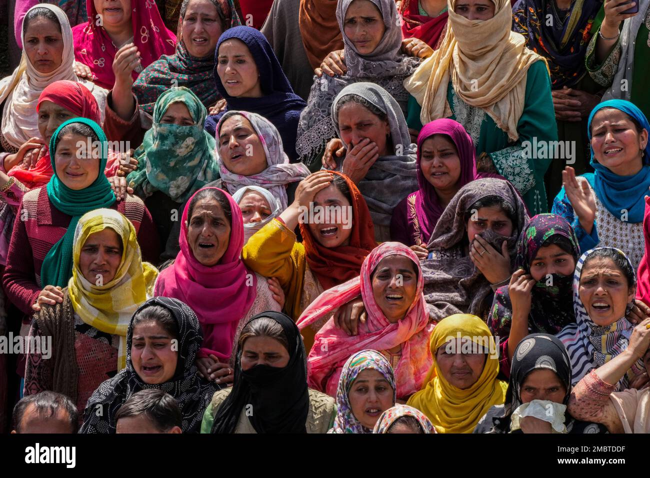 Kashmiri villagers cry during the funeral of Indian policeman Ishfaq ...