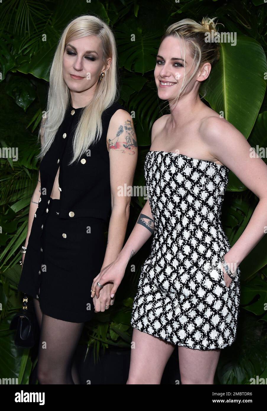 Dylan Meyer, left, and Kristen Stewart arrive at the Chanel 13th annual ...