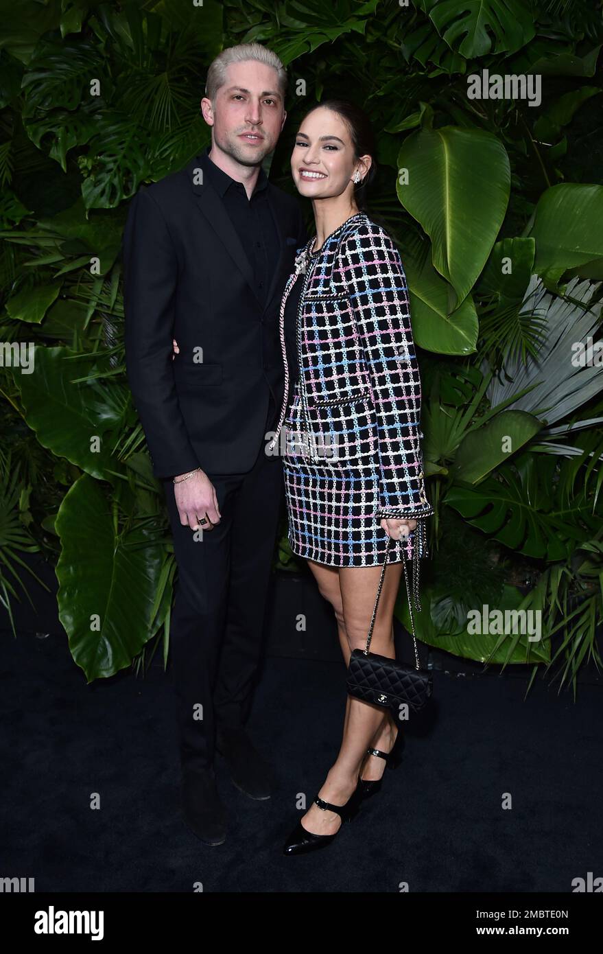 Michael Shuman, left, and Lily James arrive at the Chanel 13th annual ...