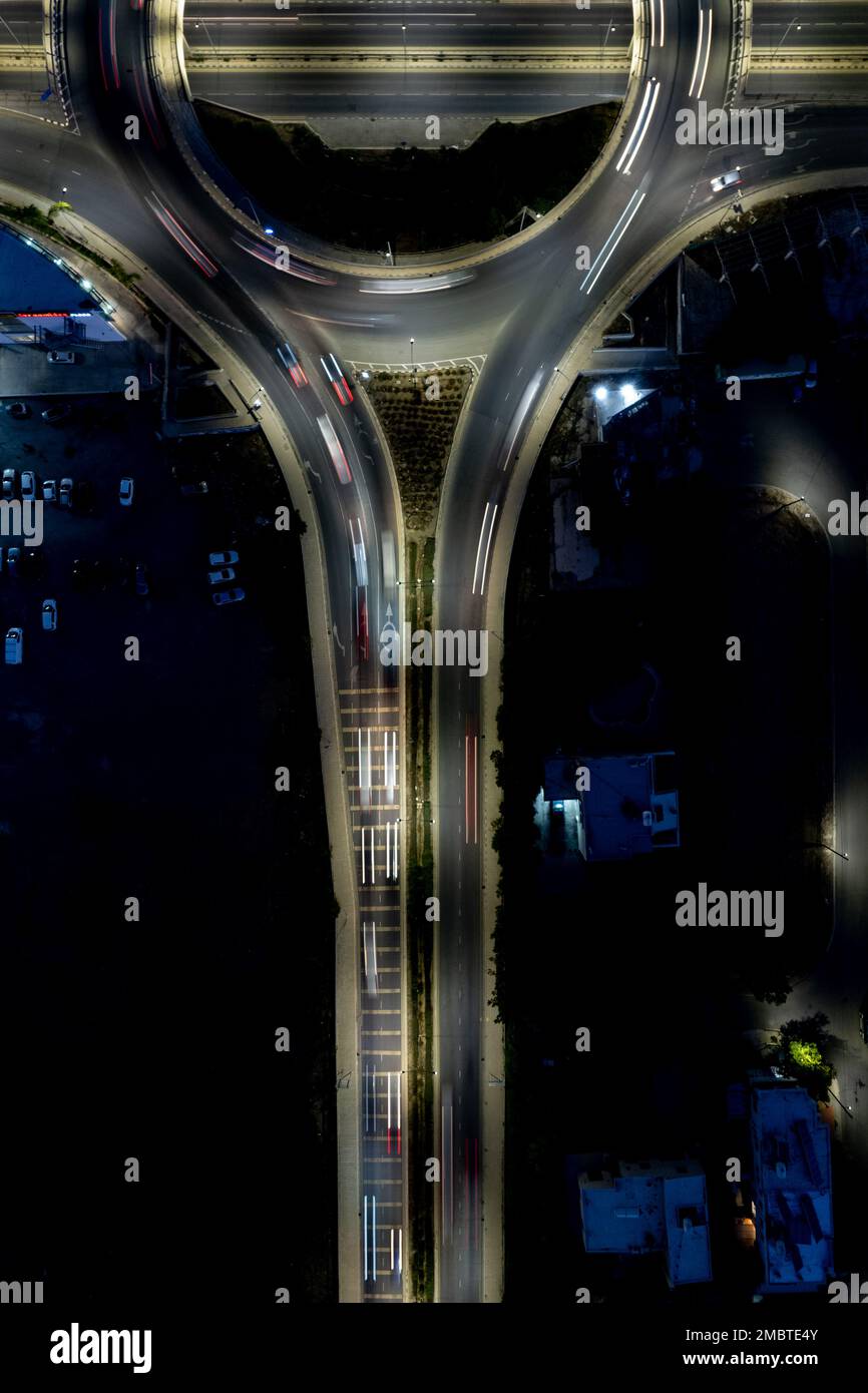 Drone aerial of motorway junction. Roundabout with cars moving ...