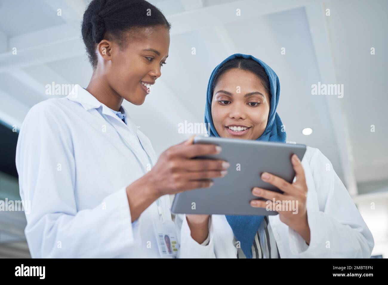 The best gadget in a scientists toolkit. two young scientists using a ... The best gadget in a scientists toolkit. two young scientists using a ...