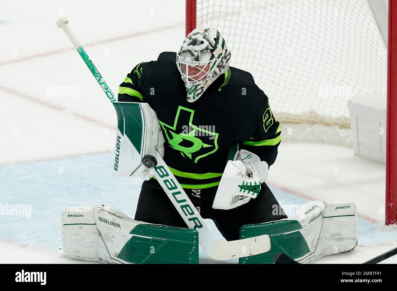 Dallas Stars goaltender Jake Oettinger blocks a shot during the first ...