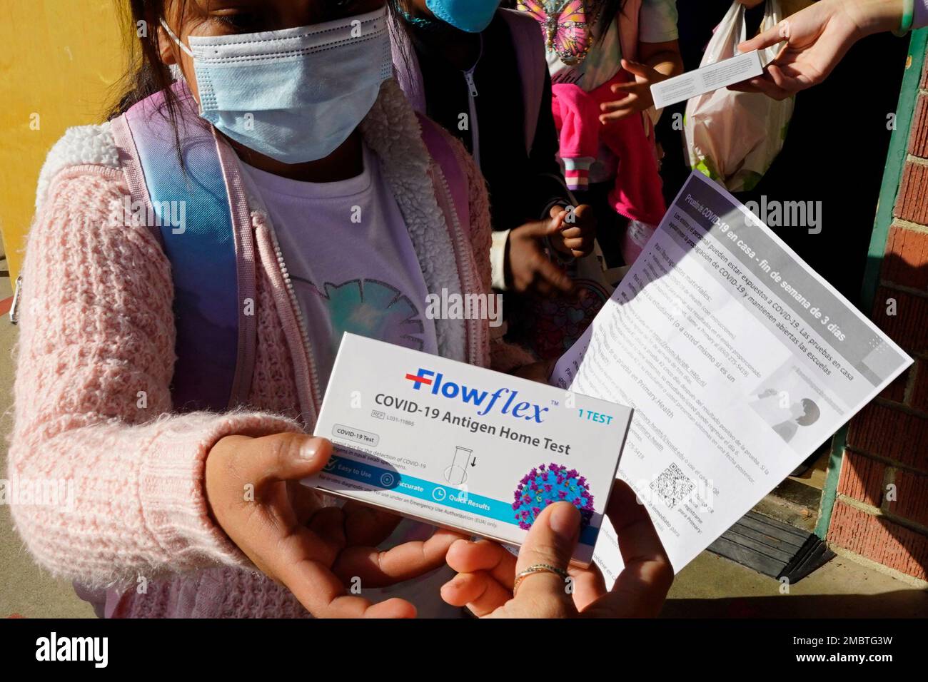FILE - A second grade student is given a at-home COVID-19 test at H.W ...